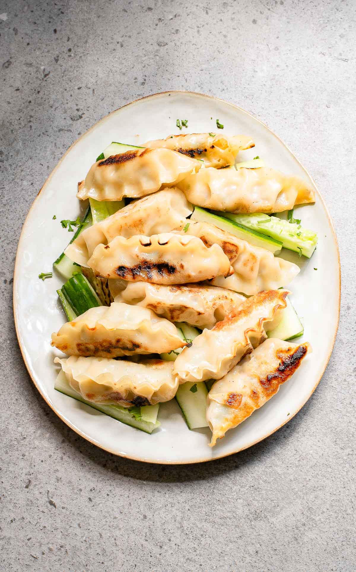 Dumpling Salad with Smashed Cucumbers and Peanut Dressing - All The Noodles