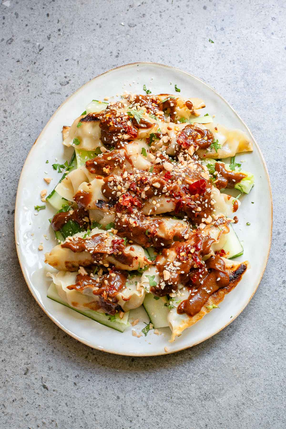 Dumpling Salad with Smashed Cucumbers and Peanut Dressing - All The Noodles