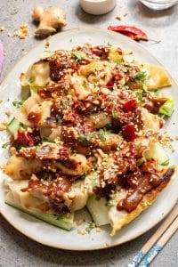 Dumpling Salad with Smashed Cucumbers and Peanut Dressing - All The Noodles